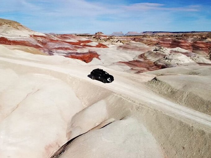 When your rental car becomes an explorer's vessel through landscapes that look like Mars decided to vacation on Earth.