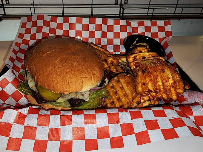 This burger doesn't just satisfy hunger&mdash;it obliterates it. Nestled alongside those waffle fries, it's the comfort food equivalent of a warm hug from your favorite aunt.