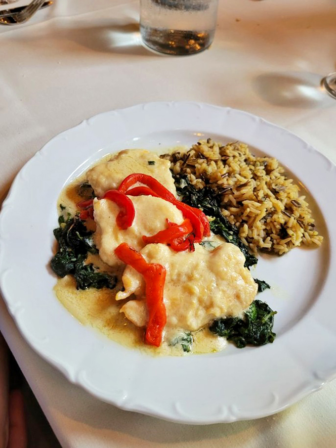 Chicken nestled on a bed of spinach with roasted red peppers &ndash; comfort food that somehow manages to feel virtuous and indulgent simultaneously.