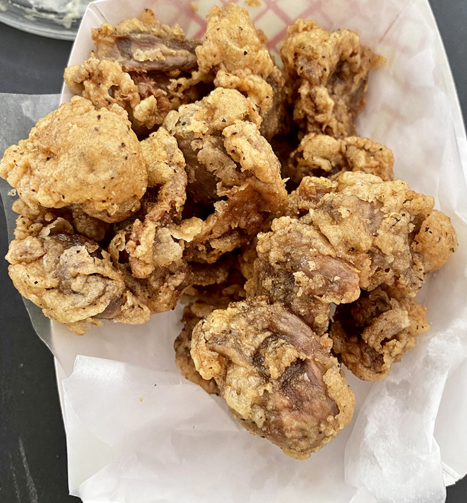 Chicken gizzards for the brave and the wise. These crispy golden nuggets are the culinary equivalent of finding money in an old jacket pocket.