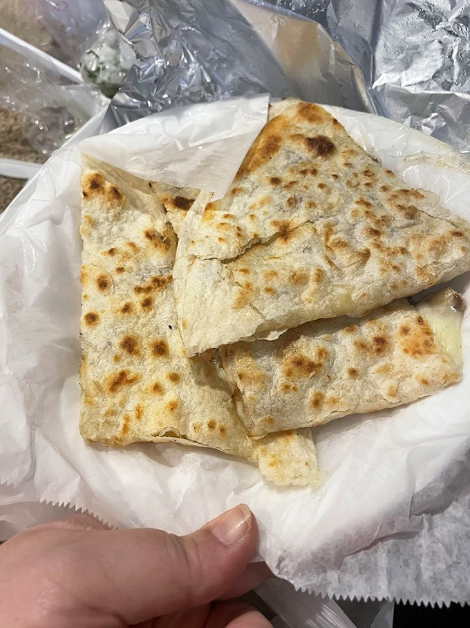Perfectly grilled, gloriously simple. This quesadilla proves that sometimes the best things in life are just cheese, tortillas, and a hot grill.