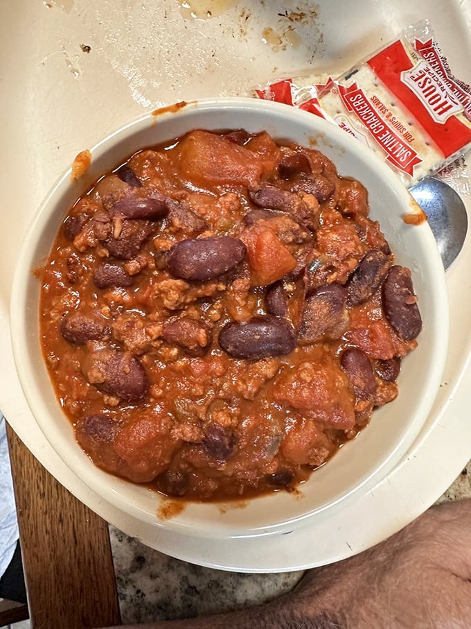 Chili that looks like it's been simmering since yesterday, packed with beans and meat in perfect harmony. The kind of bowl that warms you from the inside out.