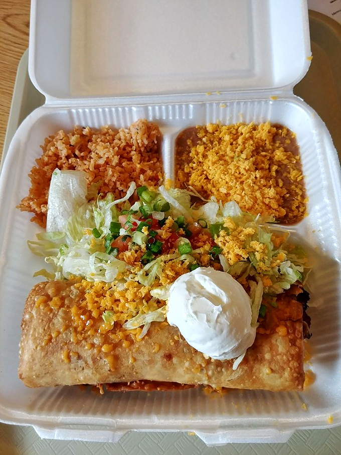 Behold the chimichanga in its natural habitat: accompanied by rice and beans, ready to cure whatever ails you.