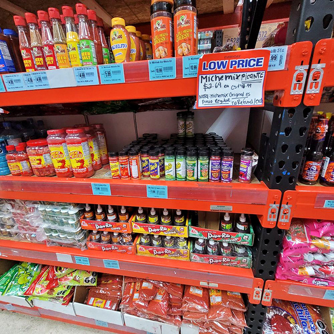 Hot sauces and seasonings line the shelves, proving that Alamo Candy Company understands flavor goes beyond just sweet indulgences.