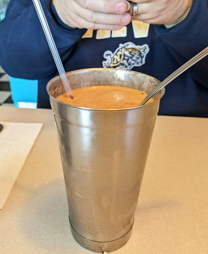 This isn't just a milkshake; it's a silver chalice of happiness with two straws &ndash; one for drinking, one for when the first one gets tired.