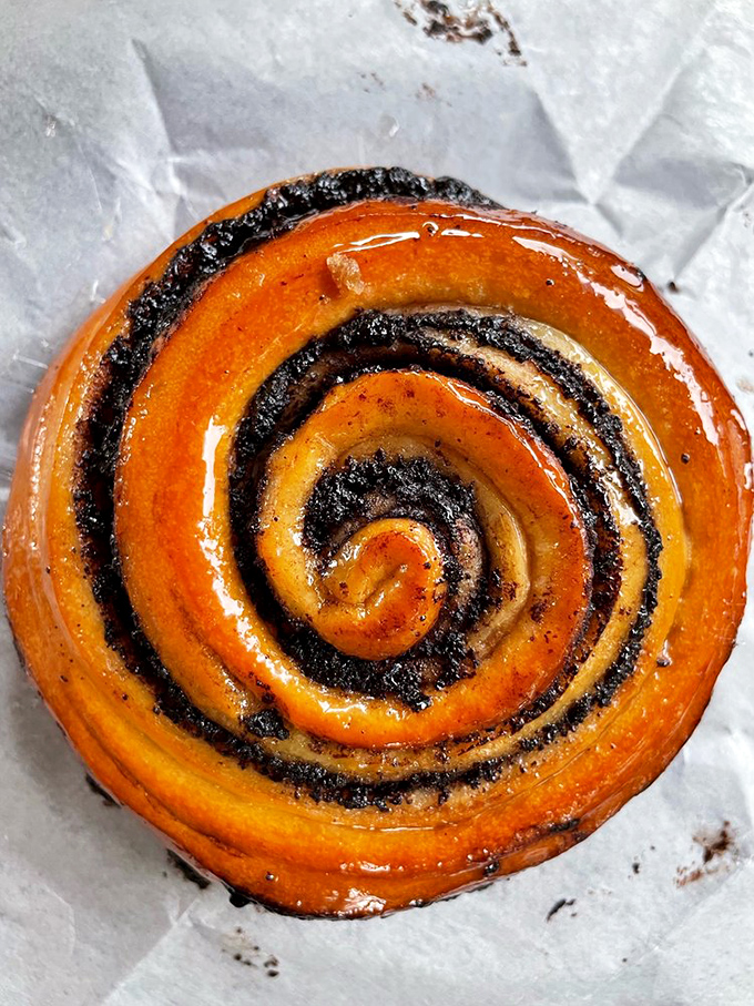 The cinnamon bun's hypnotic swirl might actually possess mind-control properties – suddenly you're ordering one for now and another "for later."