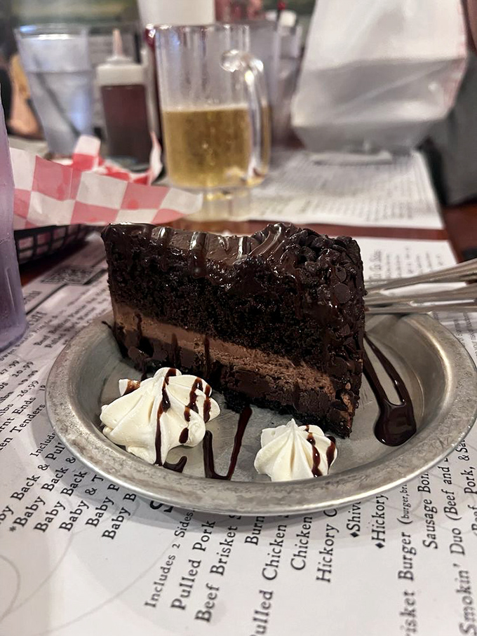 A slice of chocolate cake so decadent it requires a moment of silence before diving in &ndash; dessert as a religious experience.