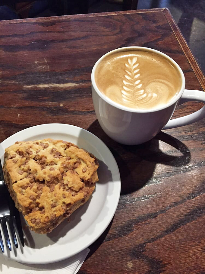 The perfect pairing: a latte with leaf art alongside a scone that's crumbly in all the right places. Breakfast of champions, really.