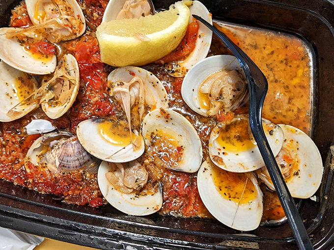 These clams aren't just seafood; they're little oceanic treasures bathed in a broth that would make Neptune himself ask for seconds.