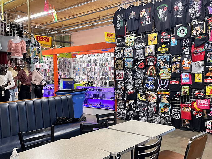 T-shirt heaven meets accessory nirvana in aisles where shopping becomes cultural exploration and souvenir-hunting reaches Olympic sport status.