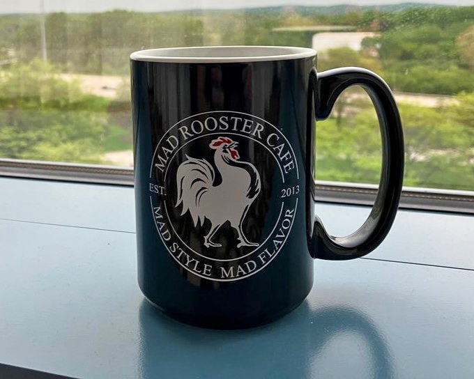 Their coffee mug doesn't just hold caffeine&mdash;it's a declaration of breakfast philosophy: "Mad Style, Mad Flavor" is more promise than slogan.