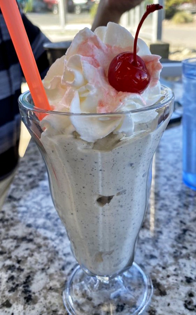 Not just a milkshake, but a life decision. Cookies and cream topped with whipped cream and a cherry&mdash;dessert masquerading as a beverage.