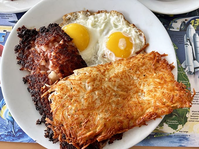 Corned beef hash with eggs and hash browns&mdash;the holy trinity of breakfast that's worth setting your alarm for.