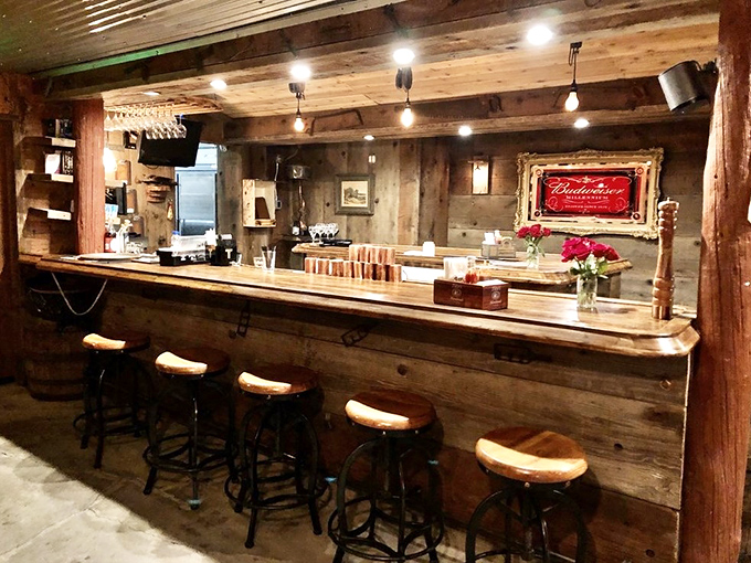 This isn't just a bar&mdash;it's a shrine to straightforward hospitality. Those saddle-style stools aren't trying to be cute; they're preparing you for the Western feast ahead.