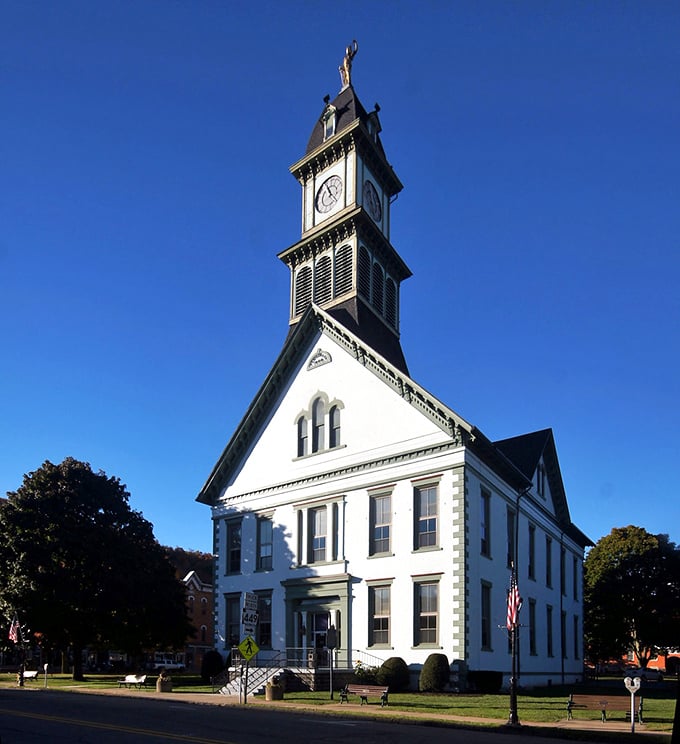 The Potter County Courthouse stands tall against a perfect blue sky. That clock tower has kept Coudersport on schedule since the Civil War era.