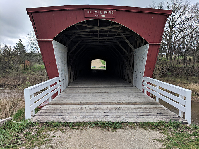 The Holliwell Bridge beckons you into its wooden embrace, a passage through time where you can almost hear the whispers of Waller's star-crossed lovers.