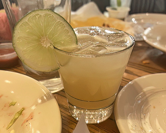 A perfectly chilled margarita with a lime wedge perched on the rim&mdash;the ideal companion for navigating a Texas-sized menu.