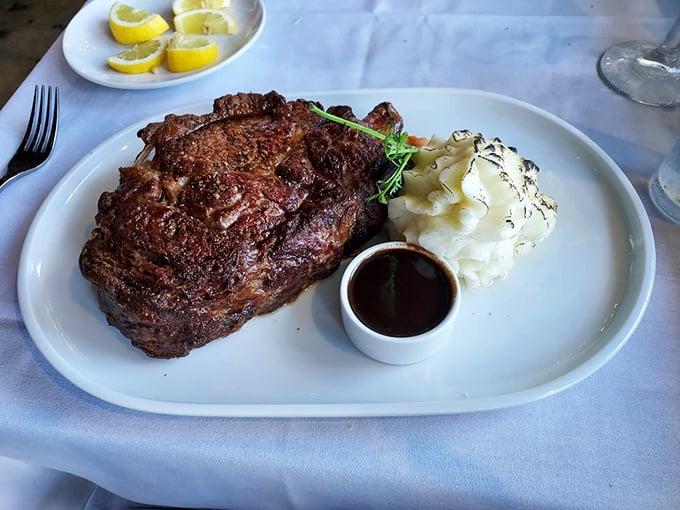 This magnificent ribeye isn't just dinner&mdash;it's an event, with that sauce cup standing by like a loyal sidekick ready for action.
