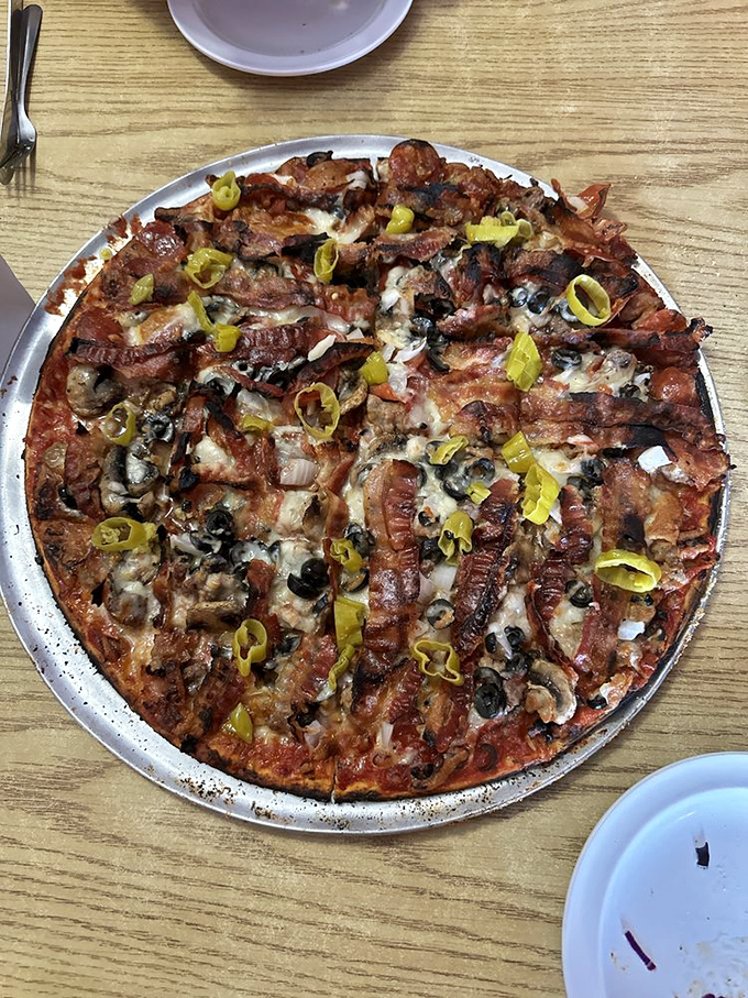 Pizza that doesn't apologize for its Midwest accent. Those banana peppers and bacon strips aren't just toppings&mdash;they're declarations of independence.