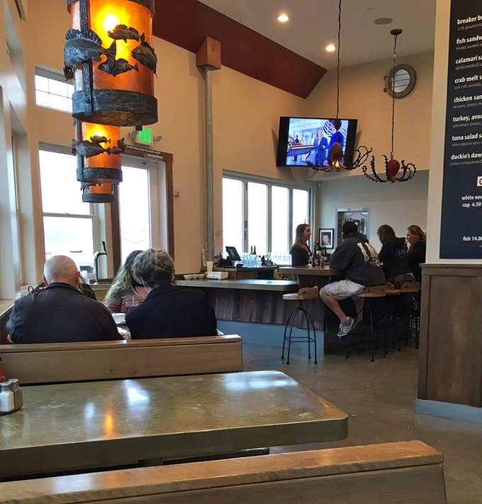 The warm glow of those distinctive pendant lights transforms everyday dining into a coastal California memory you'll revisit during landlocked winter days.