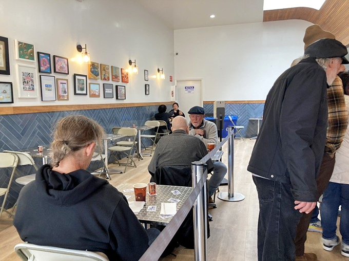 The dining area: where strangers become temporary friends, united by the universal language of fried dough appreciation.