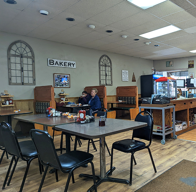 Church-inspired window frames watch over diners in the bakery section. This isn't just eating—it's a communion of comfort food.