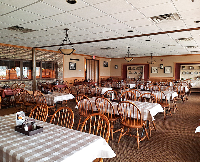 The dining room waits patiently between meals, like a theater between performances. Those Windsor chairs have supported generations of satisfied diners.