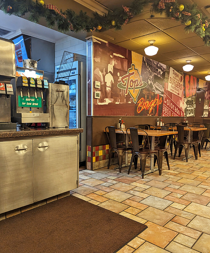 The wall murals tell stories of burgers past while modern metal chairs invite you to create new memories. History and hunger unite here.