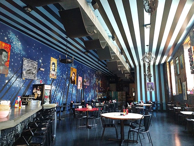 The dining area feels like breakfast theater, with the striped ceiling drawing your eye upward and the starry blue wall setting a dreamy tone.