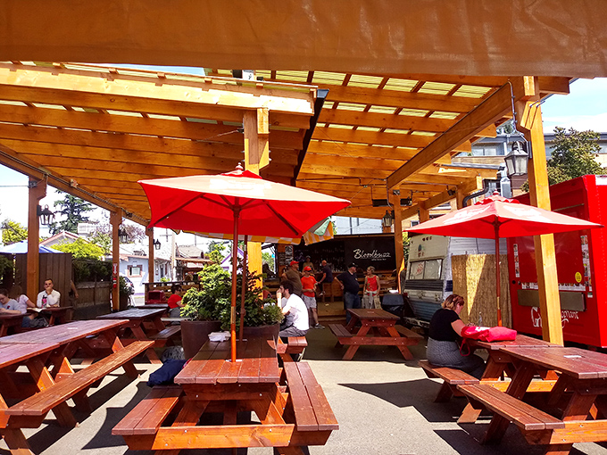 The covered dining area transforms an ordinary parking lot into Portland's most coveted outdoor dining room. Sunshine optional, satisfaction guaranteed.