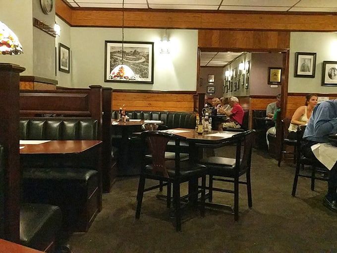 Dark wood booths and simple tables create dining zones that feel private enough for secrets but communal enough for laughter. Norman Rockwell would approve.