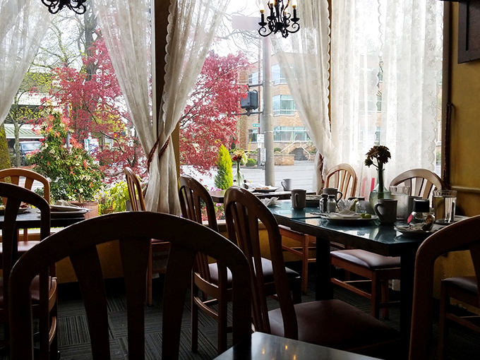 Lace curtains filter the Portland light while wooden chairs invite you to settle in for a meal worth lingering over.