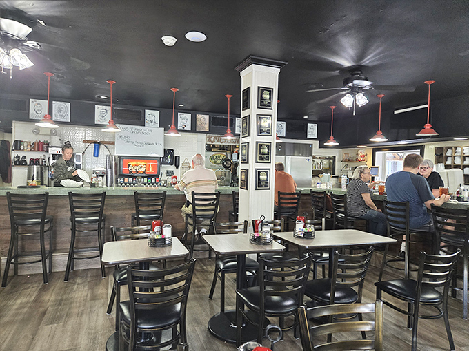 The dining area where strangers become neighbors over plates of comfort food. Those pendant lights have witnessed countless "you've got to try this" moments.
