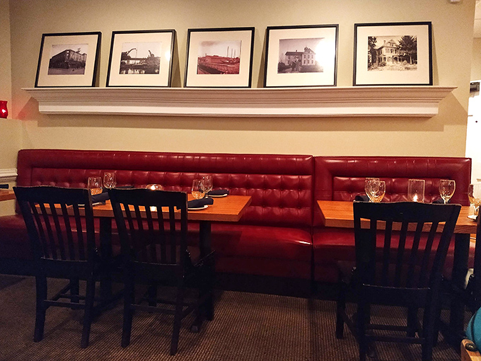 Red leather booths and historic photos create that rare atmosphere where you could propose marriage or debate baseball stats with equal comfort. 