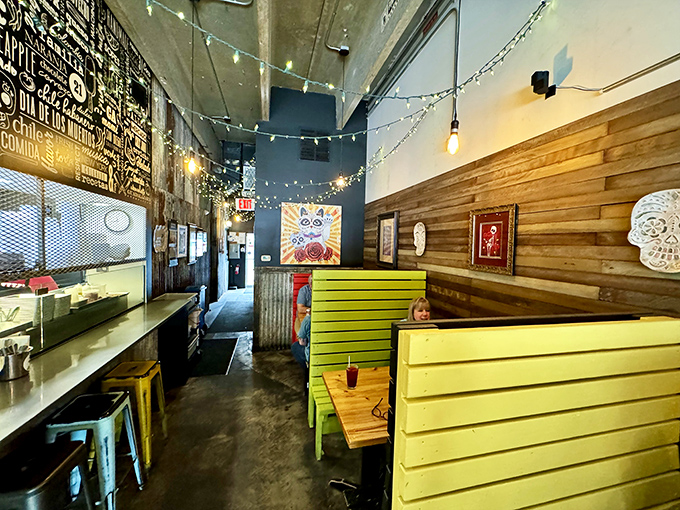 Where strangers become friends over shared guacamole. The colorful chairs are as vibrant as the conversations happening around them.