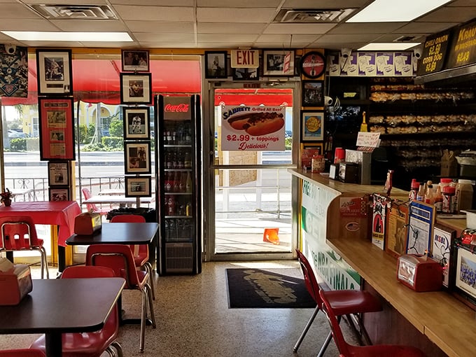 Red chairs and memorabilia-lined walls create the perfect backdrop for the serious business of hot dog appreciation.