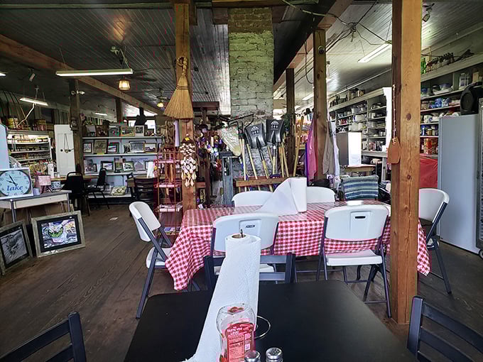 Red-checkered tablecloths and mismatched chairs create the dining area where strangers become friends over shared stories and second helpings.