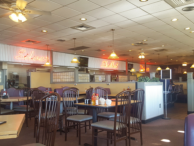 Classic diner seating that whispers tales of countless road trips, family meals, and conversations that changed lives &ndash; or at least satisfied appetites.