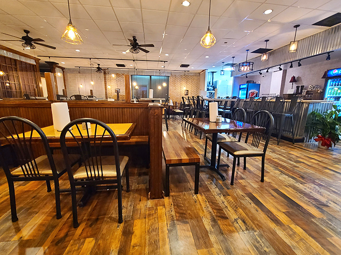 Rustic meets refined in this thoughtfully designed space. The reclaimed wood floors and corrugated metal accents create the perfect barbecue ambiance.
