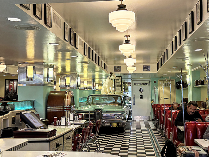 The dining area feels like a movie set where the 1950s never ended and calories still counted as essential nutrients.