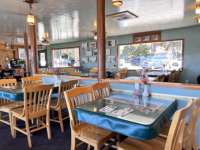Simple wooden chairs, teal-trimmed tables, and large windows&mdash;because when you're serving seafood this good, the d&eacute;cor knows to play supporting role.