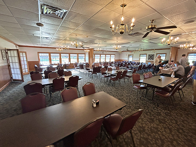 A dining room designed for lingering conversations and second helpings. Those chandeliers have witnessed countless "I shouldn't, but I will" dessert decisions.