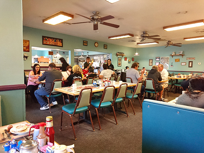 Where ceiling fans spin stories overhead while tables below host everything from business deals to family reunions to hangover recoveries.