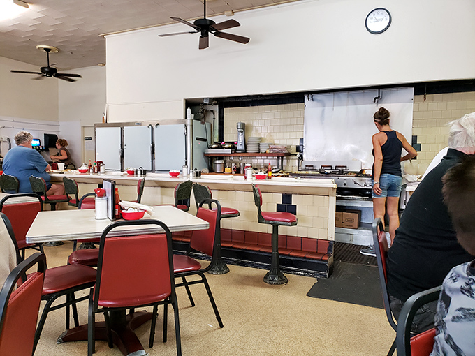 The open kitchen and counter seating create dinner theater where the stars are eggs cracked with one hand and pancakes flipped with practiced precision.
