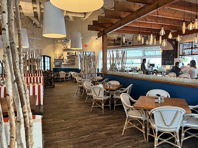 Birch branches create natural dividers in a space that feels both intimate and social – like dining in a stylish treehouse designed for grown-ups.