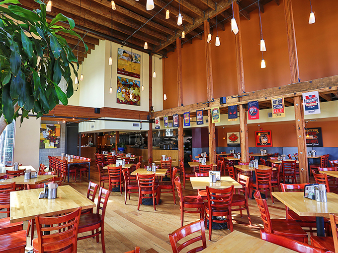 The dining room feels like the living room of that friend who's cooler than you. High ceilings, warm woods, and red chairs create an inviting vibe.