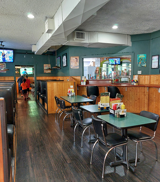 Retro diner tables and chairs that have supported generations of happy eaters. No designer furniture, just decades of burger-fueled conversations.