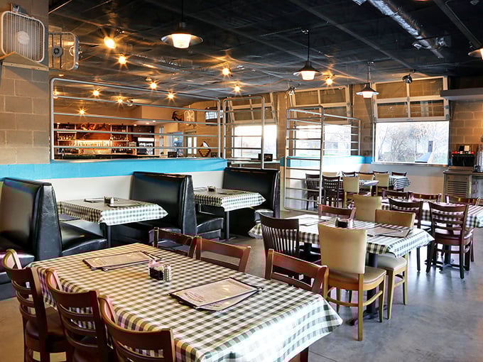 The dining area balances no-nonsense functionality with casual charm. Those checkered tablecloths aren't being ironic&mdash;they're being Texan.