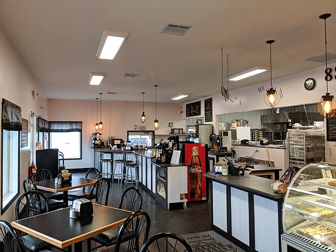 The dining area's industrial-chic pendant lights and cozy tables say, "Stay awhile. That diet can start tomorrow."