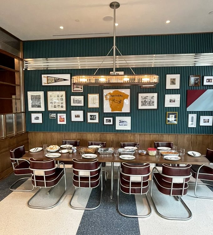 The dining area's teal wall gallery creates a space that's equal parts nostalgic and modern&mdash;like your coolest friend's living room, but with better food.